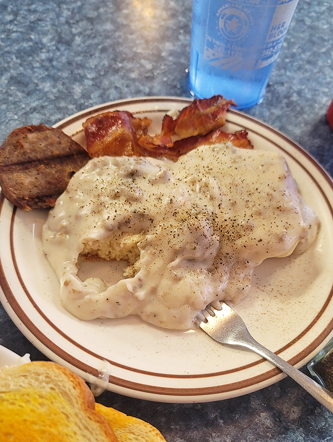 Biscuits and gravy that would make your grandmother both proud and slightly jealous. Pepper specks like stars in a creamy galaxy.