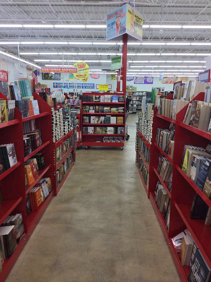 The book aisle stretches toward retail infinity, promising literary adventures at prices that make public libraries nervous about the competition.