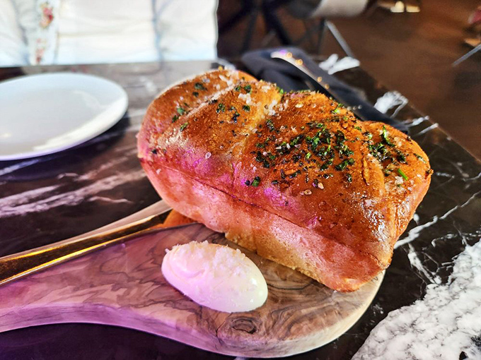 Garlic bread elevated to art form&mdash;this golden loaf isn't just a prelude to dinner, it's a statement piece worthy of its own spotlight.