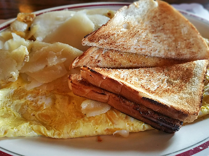 Breakfast that understands its mission: golden toast, perfectly cooked eggs, and potatoes that have been properly introduced to seasoning. Morning fuel done right.