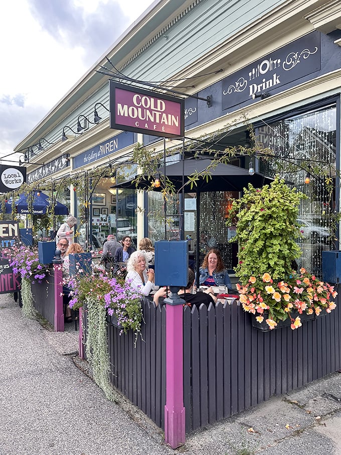 Cold Mountain Caf&eacute;'s outdoor seating area blooms with both flowers and conversation. Food tastes better with a side of fresh air.