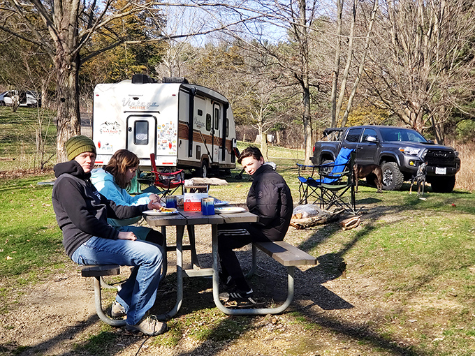 Tailgating gets a woodland upgrade when your parking spot comes with birdsong and dappled sunlight filtering through ancient pines.