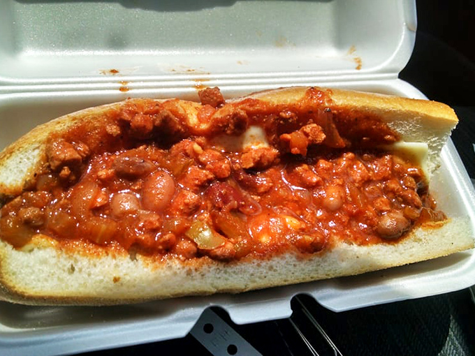 The chili dog that launched a thousand napkins &ndash; gloriously messy and unapologetically delicious in its styrofoam throne.