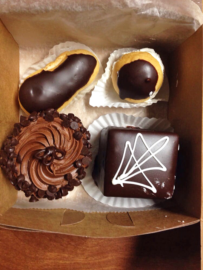 Chocolate's greatest hits in one box—eclairs, petit fours, and cupcakes that make you wonder why anyone bothers with savory food at all.