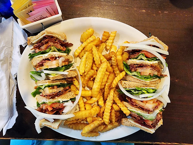 A club sandwich stacked higher than some Delaware buildings. Architecture you can eat, with layers that tell a delicious story.