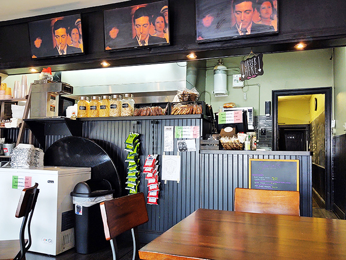 The counter view reveals the beating heart of this operation&mdash;where Sinatra watches over the kitchen like a patron saint of good eating.