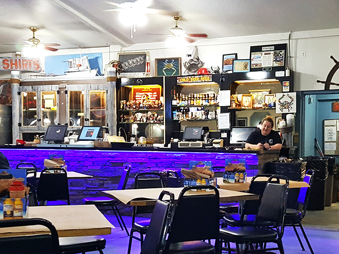 The bar area—where seafood stories get better with each telling and Old Bay seasoning might as well be pixie dust.