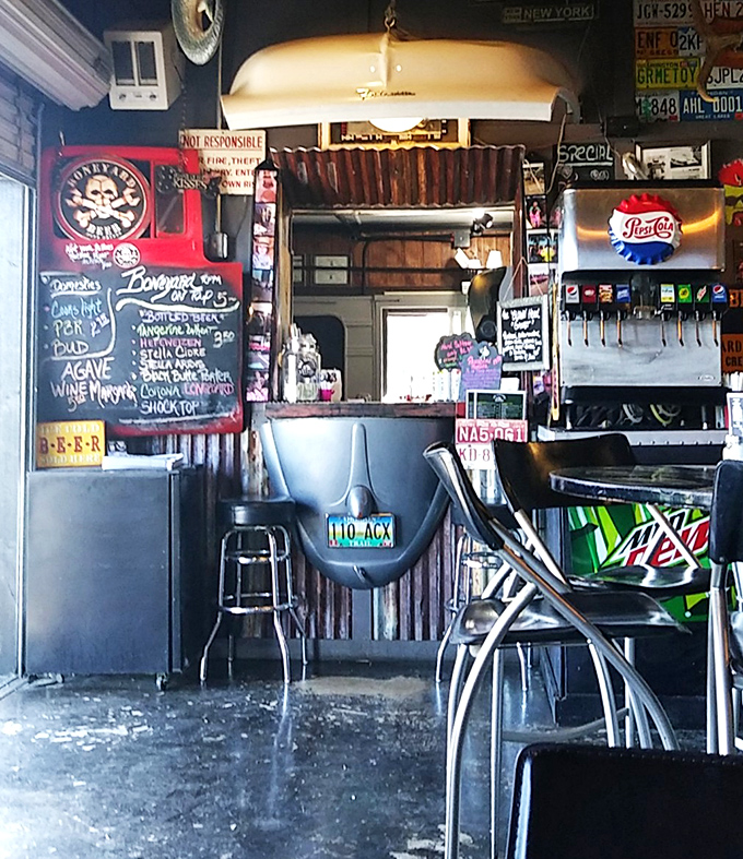 Where car parts become d&eacute;cor and soda fountains become landmarks. The counter view offers a front-row seat to burger artistry in action.
