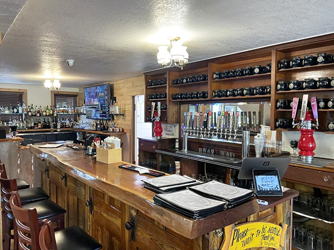 Behind this bar, liquid happiness flows from taps that connect directly to German brewing traditions. The bottles stand at attention, awaiting their moment.