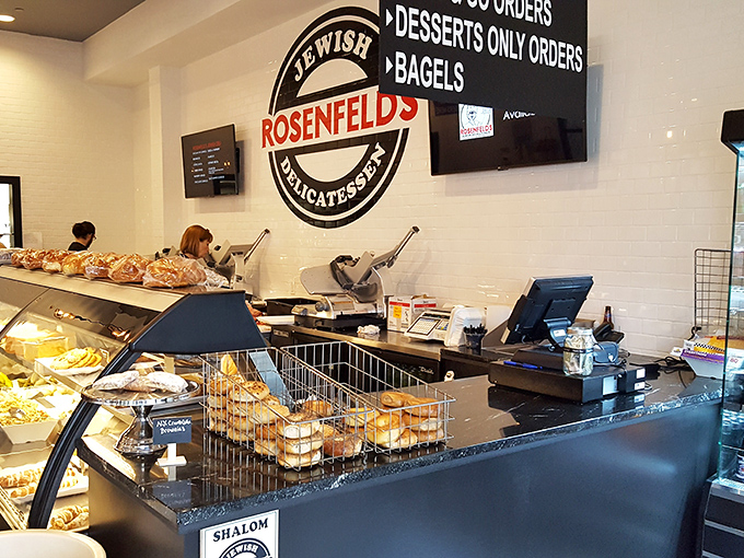 The deli counter: where dreams come true and diets go to die. That "Shalom" sign welcomes you to a world of caloric bliss.