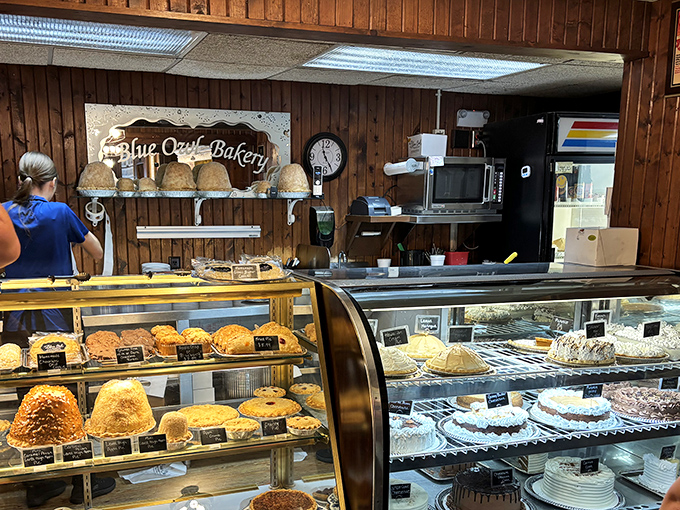 Pie paradise in plain sight. The bakery counter showcases towering creations that make choosing just one a nearly impossible task.