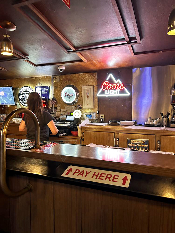 "Pay Here" says the sign, but what it really means is "Exchange currency for happiness" at this no-frills counter.