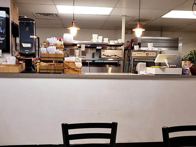 Behind this counter, culinary magic happens. The open kitchen design means you can watch your chicken transform from ordinary to extraordinary.