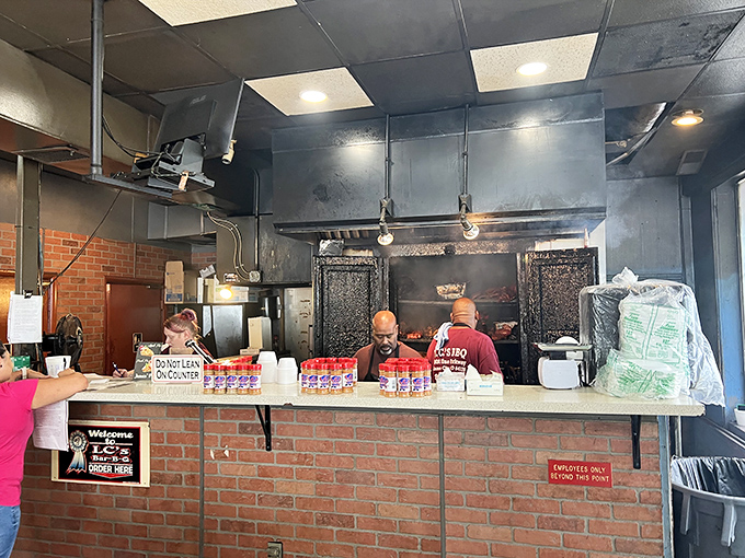 Behind this counter, pitmasters perform the daily ritual of slicing and serving meat that's achieved barbecue enlightenment through smoke and patience.