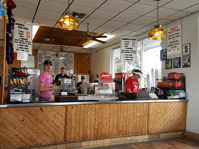 Behind this wooden counter, sandwich magic happens daily&mdash;where fresh-sliced meats meet the transformative power of steam in a ritual unchanged since 1968.