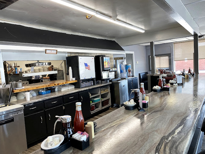 Behind this counter, breakfast wizardry happens with the precision of a Swiss watch and the soul of Southern hospitality.