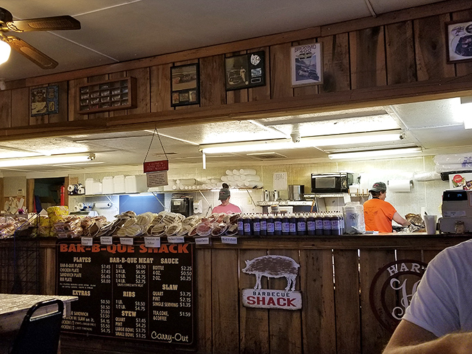 Behind this counter, barbecue magic happens daily. The busy kitchen crew orchestrates a symphony of smoke and flavor for hungry patrons.