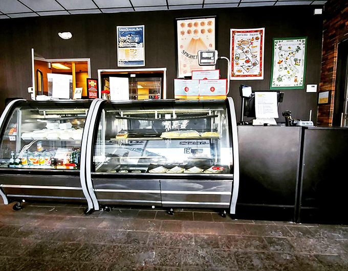 The pasta display case—where dreams are born and diets go to die. Each selection promises a different path to carb-laden bliss.