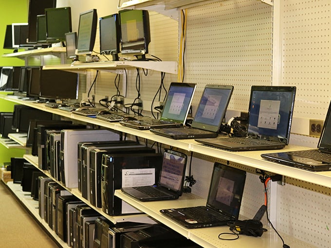 Technology heaven! Rows of laptops and monitors waiting for their next chance to help someone connect, create, or binge-watch.