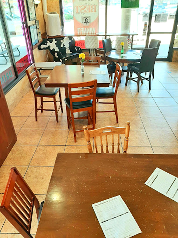 The dining area offers no-nonsense seating for serious ice cream contemplation, free from distractions except your companion's envious glances. 