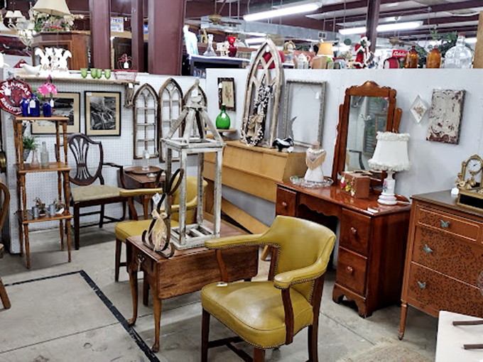 Vintage furniture arranged like a living room waiting for its close-up. That yellow chair isn't just seating&mdash;it's a conversation starter with legs.