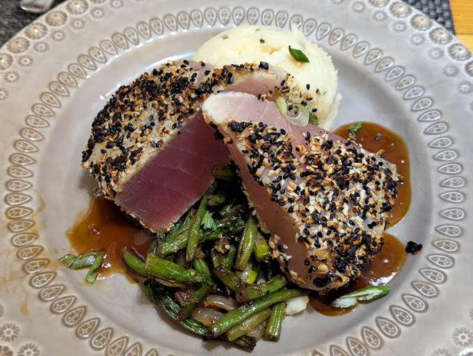 Sesame-crusted tuna, seared perfectly rare, proves there's more to mountain dining than meat. The seafood here travels farther than most visitors to reach Eggleston.