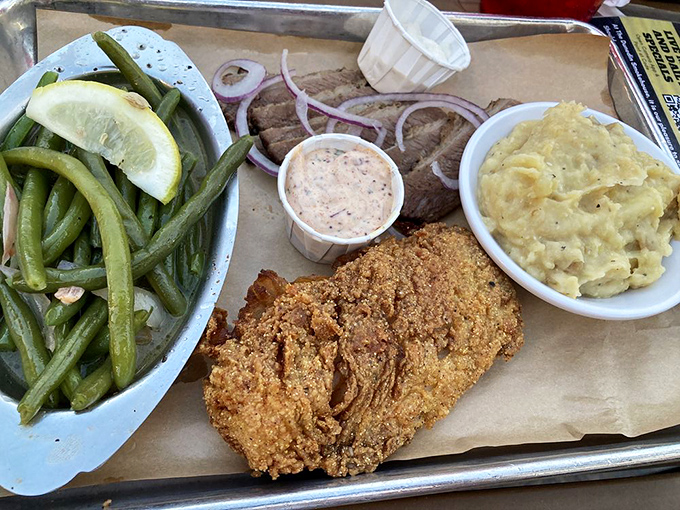 This fried cod platter with green beans and mac and cheese proves that smokehouse chefs know their way around the sea too.