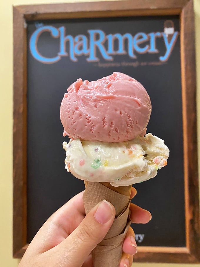 Whimsy in waffle form. That playful pink scoop atop birthday cake ice cream is the culinary equivalent of confetti at a parade.