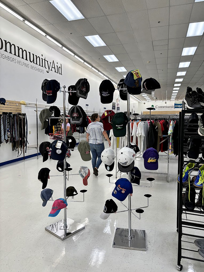 The hat display: a rotating gallery of headwear history. From vintage baseball caps to sun hats that have shaded previous owners through countless summers. 