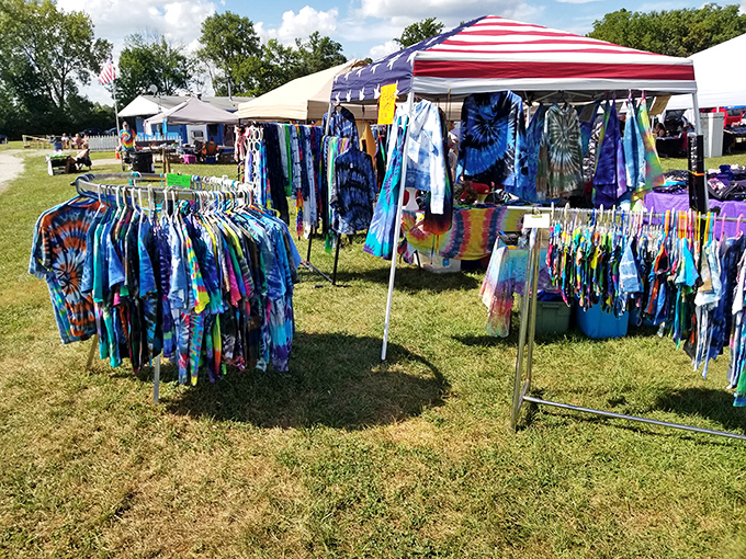 Tie-dye vibrance brings festival flair to the drive-in grounds, where movie night meets marketplace in a quintessentially American mashup.