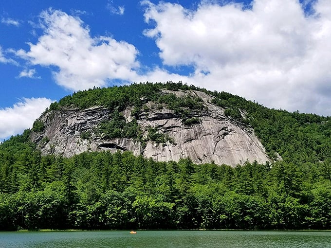 Cathedral Ledge stands sentinel over Echo Lake, its granite face telling geological stories that span millions of years.