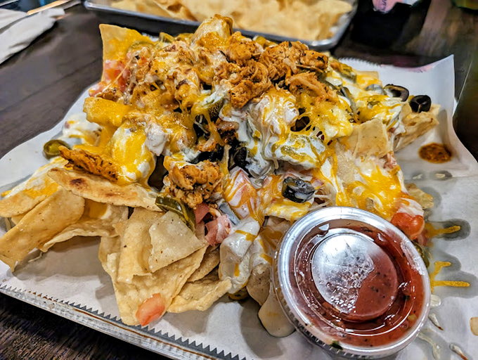 These nachos aren't messing around&mdash;they're the "bring reinforcements" size. A mountain of toppings that requires strategic eating techniques.