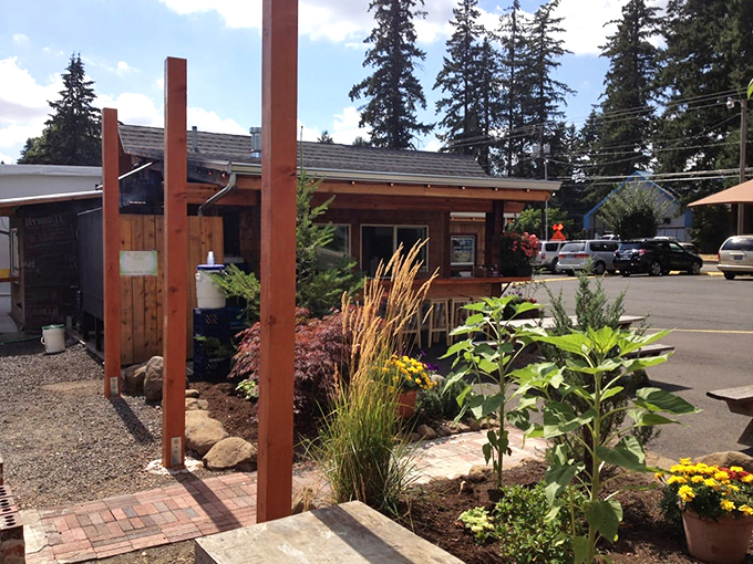 A garden patio area where the aroma of smoking meats mingles with flowering plants. Even the outdoor spaces here have thoughtful touches.