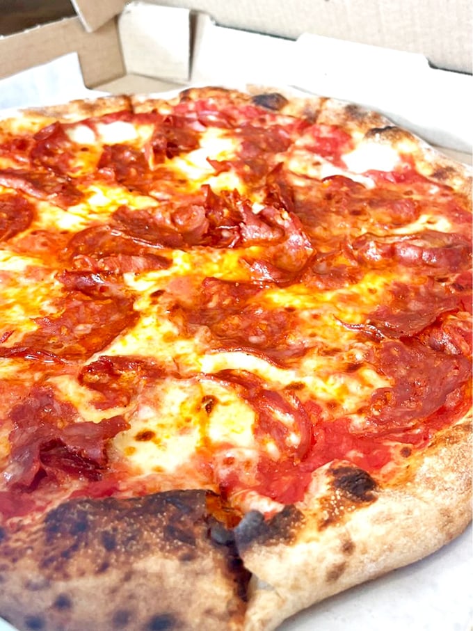 Even in a pasta palace, this pizza demands attention&mdash;perfectly charred crust supporting a landscape of melty cheese and savory toppings.