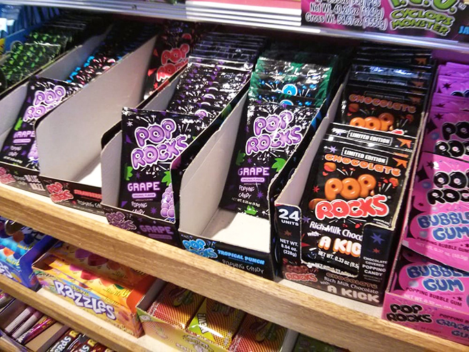 Pop Rocks – those fizzy time capsules from childhood – lined up like colorful ammunition for your next sugar rush assault.
