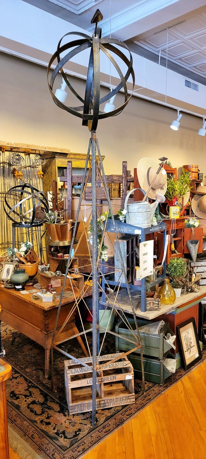 This towering garden ornament commands attention amid a sea of rustic treasures &ndash; part sculpture, part conversation piece.