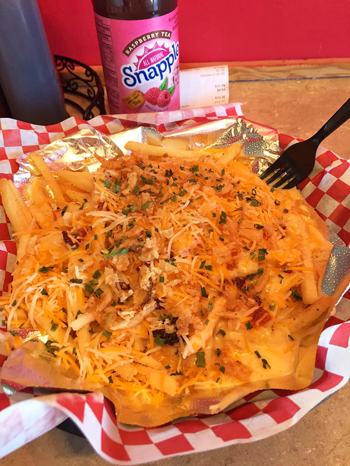 Cheese-draped fries topped with seafood create the ultimate indulgence. Diet plans tremble at the mere sight of this masterpiece.