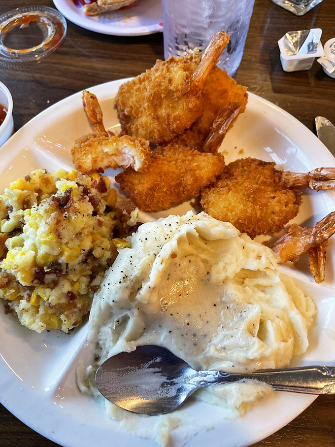 These golden-fried shrimp perched atop cloud-like mashed potatoes could convert even the most committed landlubber into a seafood enthusiast.