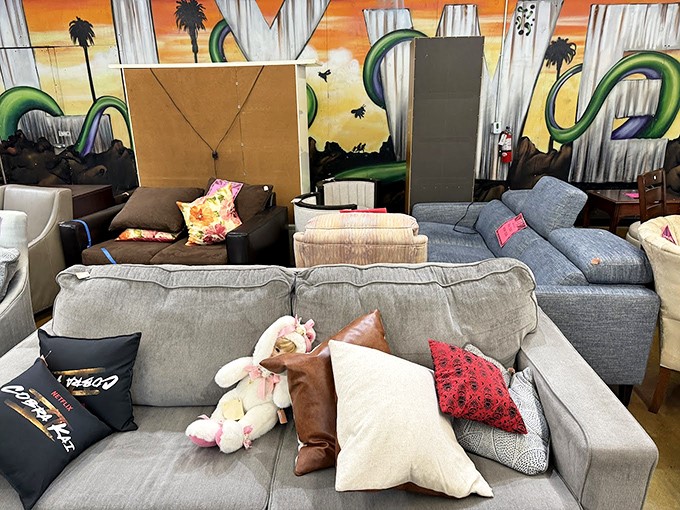 Sofa city! Test-drive your potential new living room centerpiece against the backdrop of a mural that screams "this is definitely Los Angeles."