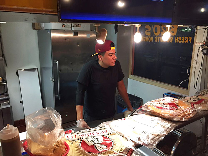 Tortilla whisperers at work. Behind every great burrito is someone who knows exactly how much filling constitutes "perfect" rather than "explosion."