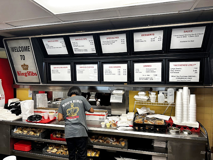 The ordering counter: where dreams and hunger meet. Notice nobody's checking their phone&mdash;the menu board has everyone's complete attention.
