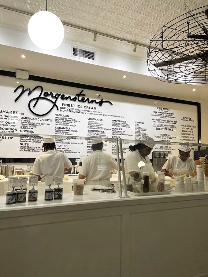 The staff works with the precision of surgeons and the creativity of artists. White uniforms say "We take this seriously, folks."