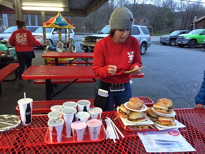 The Red Rabbit staff moves with practiced efficiency, delivering trays loaded with summer memories disguised as burgers, fries, and shakes to eager customers. 