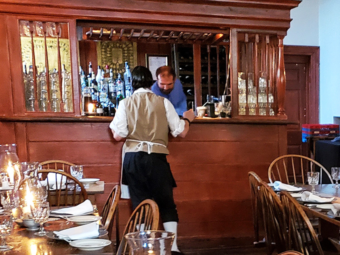 Period-dressed staff bringing historical dining to life. When he asks if you'd like more water, it feels like a constitutional amendment.