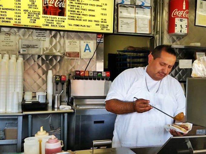 Behind every great hot dog is someone who knows exactly how to make it. The artistry happens with such ease you almost miss the magic.
