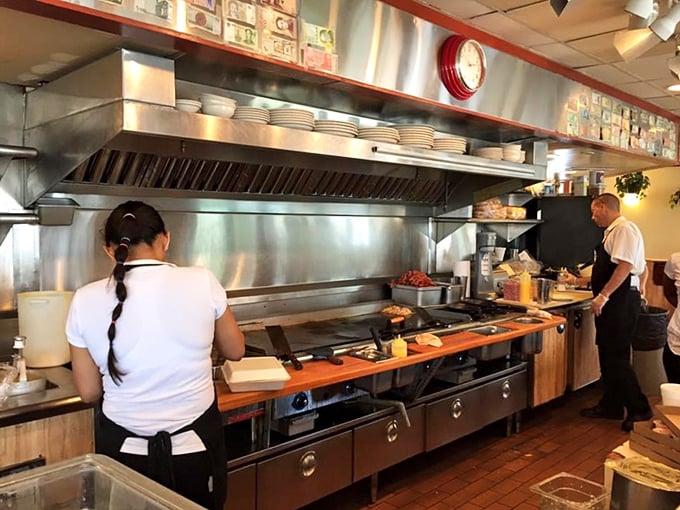 The open kitchen where breakfast magic happens&mdash;skilled hands orchestrating the sizzle and flip ballet that turns simple ingredients into memories.
