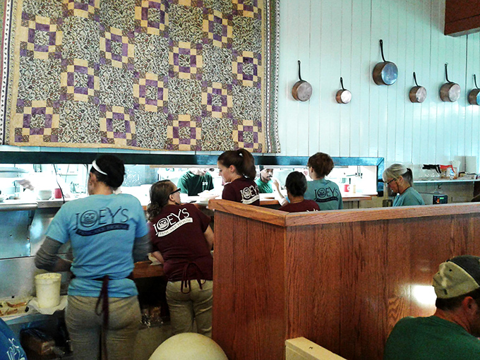 The dedicated crew works their morning magic behind the counter. These breakfast artisans have perfected their craft through years of pancake precision.