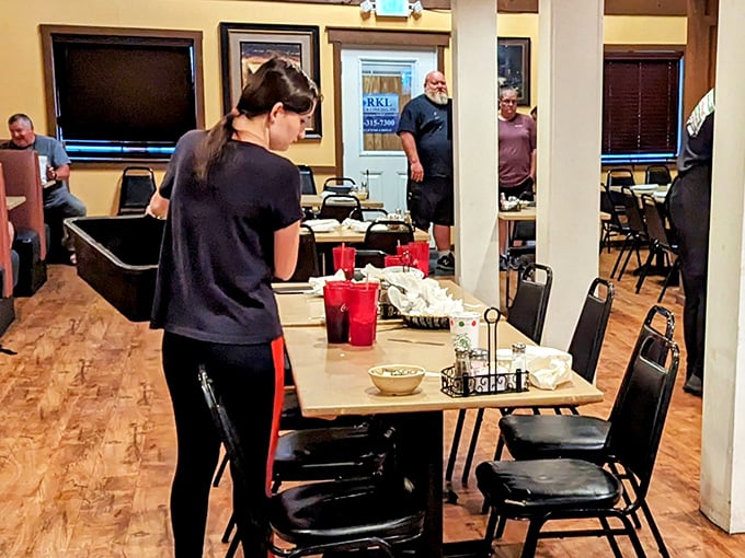 The staff moves with the practiced efficiency of people who know food is more than sustenance—it's the centerpiece of memories being made in real-time.