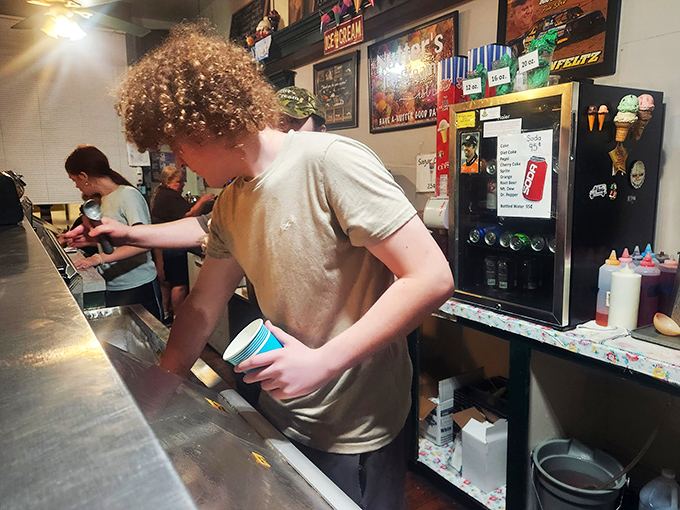 Young staff carrying on the tradition of perfect scoops&mdash;apprentices in the fine art of ice cream happiness.