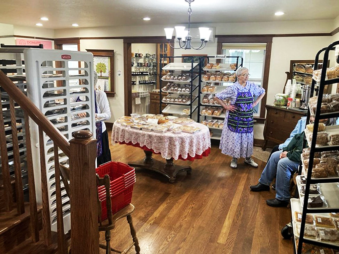 A cookie the size of your palm, held like a precious artifact. In the background, more treasures await their turn. 